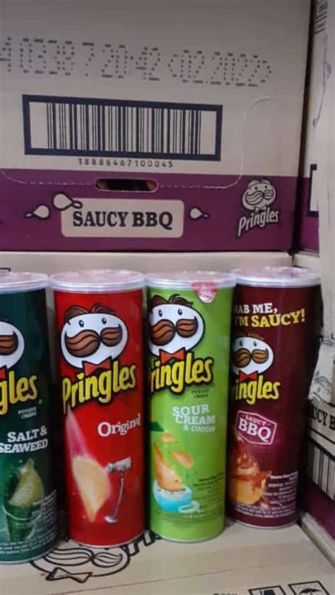 Three Varieties Of Pringles Are On Display In A Grocery Store S Shelf