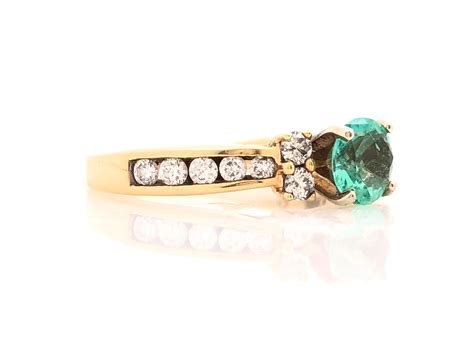 Lot 14K YELLOW GOLD EMERALD SOLITAIRE DIAMOND RING