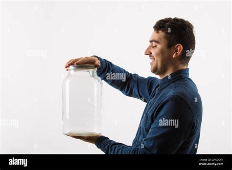Close Up Profile Portrait Of A Curious Businessman Holding An Empty
