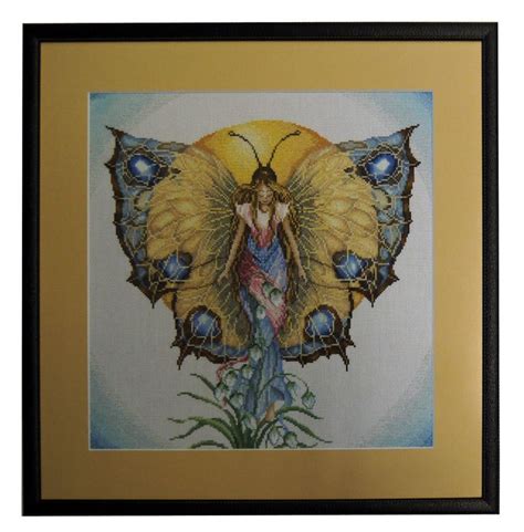A Cross Stitch Picture Of A Butterfly With A Woman In It S Body And Wings