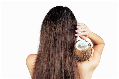 Premium Photo Sexy Nude Indian Woman Applying Coconut Oil From The