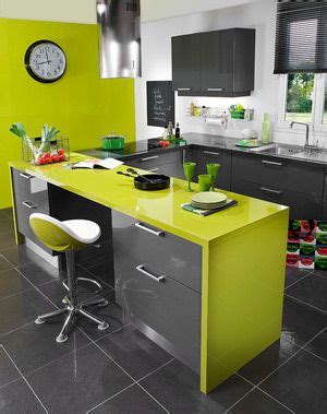 A Kitchen With Lime Green Walls And Black Counter Tops White Stools