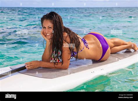Beautiful Brunette In Bikini On Her Stand Up Paddle Board In Hawaii
