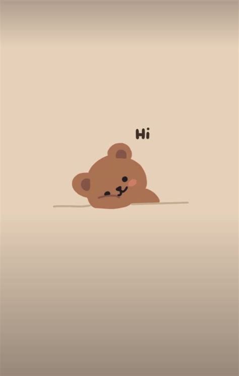 A Brown Teddy Bear Sitting On Top Of A Floor