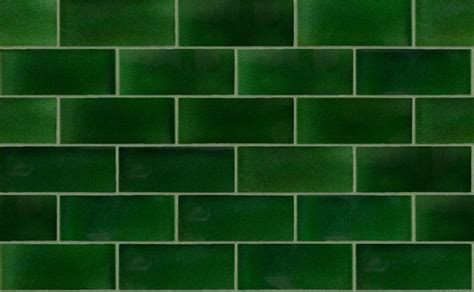 A Green Brick Wall That Looks Like It Is Made Out Of Tiles