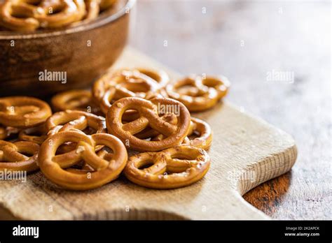 Mini Pretzels Crusty Salted Snack On Cutting Board Stock Photo Alamy