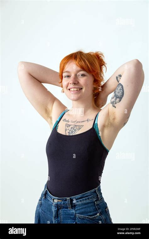 A Beautiful Woman In Her Mid Twenties With Tattoos And Unshaved Armpits