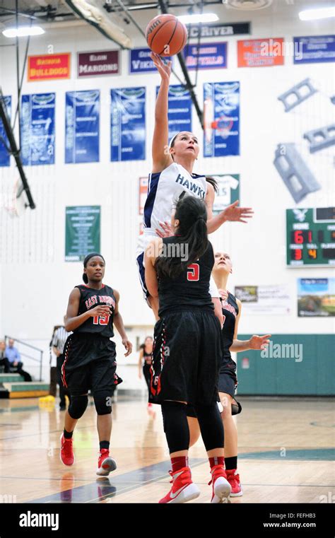An Airborne Player Shooting Well Above A Defender Braced To Take Contact And Positioned To