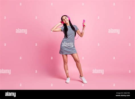 Full Length Body Size View Of Pretty Cheerful Skinny Girl Listening Different Song Rock Dancing