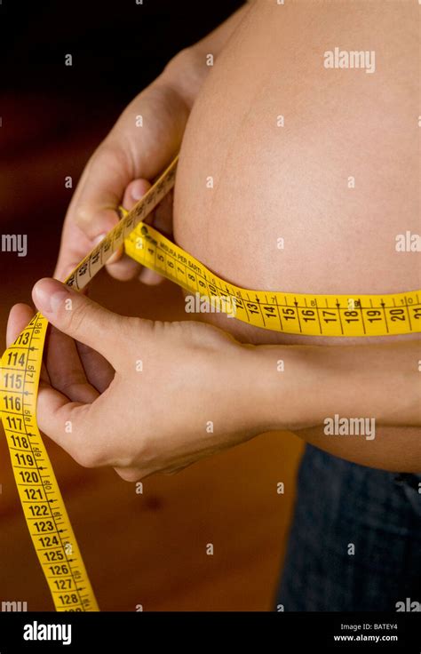 Pregnant Woman Measuring Belly Stock Photo Alamy
