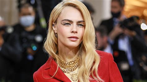 A Gold Painted Cara Delevingne Walked The Met Gala Red Carpet