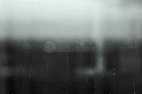 Rain Droplets On Window With Out Of Focus Background Stock Photo
