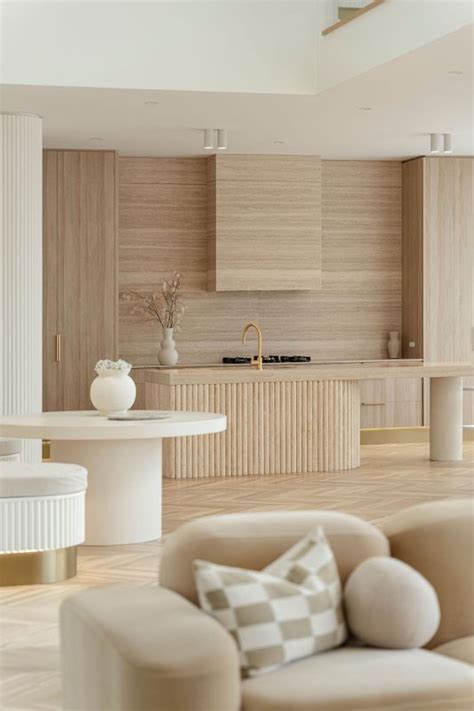 A Living Room Filled With Furniture Next To A Kitchen