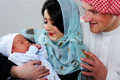 Arabic Mother And Father With Baby At Home Royalty Free Stock Image