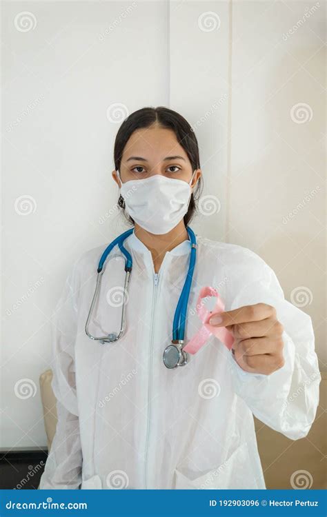 A Masked Female Robber With A Stolen Bag Of Money In Her Hands Looks