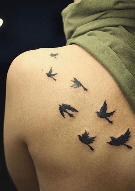 A Woman S Back With Birds Flying In The Sky On Her Left Side Shoulder