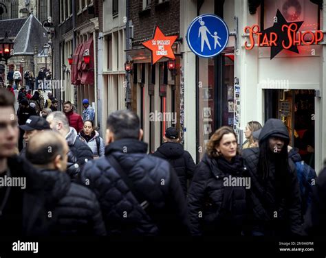 Amsterdam Tourists In The Red Light District In The Fight Against