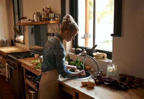 Woman Chef And Washing Food For Hygiene In The Kitchen Sink At Home For Cooking Female Person