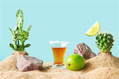 Premium Photo Shot Of Mexican Tequila With Lime And Salt Among Sand
