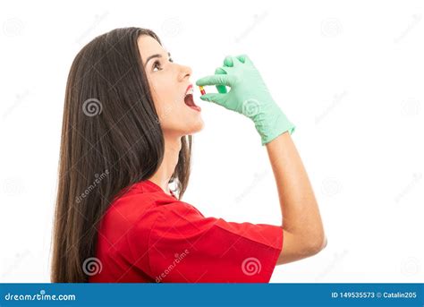 Portrait Of Beautiful Female Nurse Wearing Scrubs Taking One Pill Stock Image Image Of Person