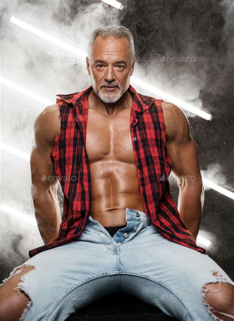 Masculine Middle Aged Male Model With Chiseled Torso Grey Beard And