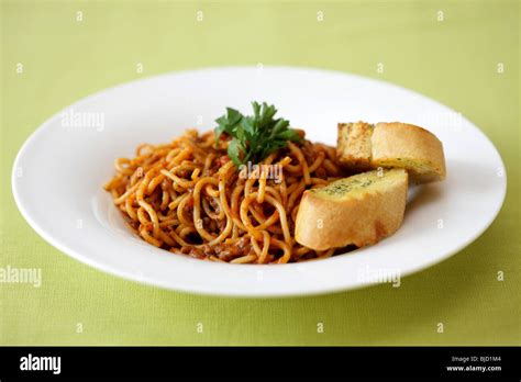 Spaghetti Bolognese With Garlic Bread Stock Photo Alamy