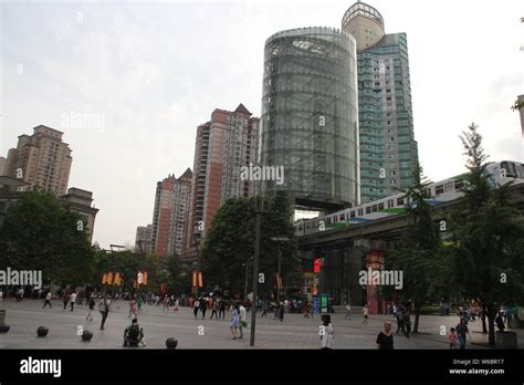 A Monorail Train Of Chongqing Light Rail Line Passes Through A Glass