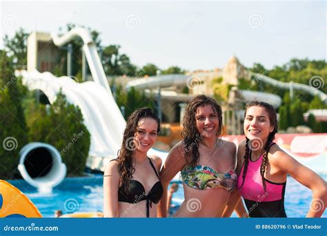 Girls Having Fun At Fun Water Park On A Summer Hot Day Stock Photo