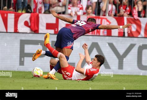 Christopher Nkunku Of RB Leipzig Benjamin Pavard Of Bayern Muenchen FC