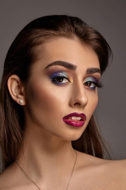 Premium Photo Naked Female In Necklace And Earrings Posing On Gray Background Bright Makeup