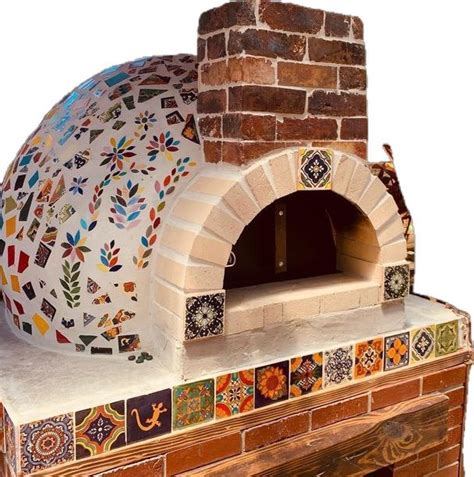 An Outdoor Brick Oven With Colorful Tiles On It