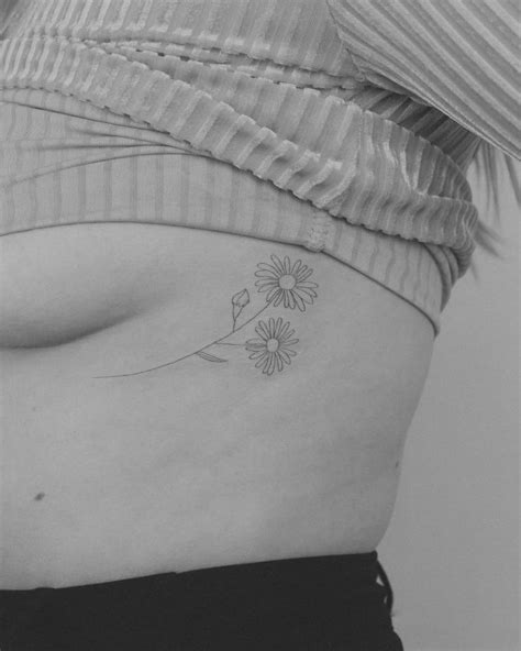 Fine Line Daisy Flowers Tattoo Located On The Side