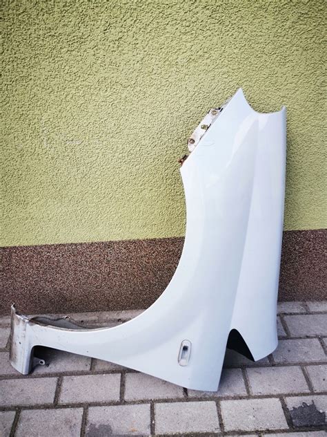 FIAT PUNTO EVO BŁOTNIK LEWY PRZÓD DEMONTAŻ 13457334127 oficjalne