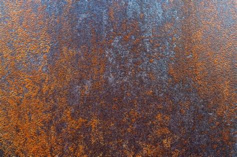 An Old Rusted Metal Surface Is Shown In This Image