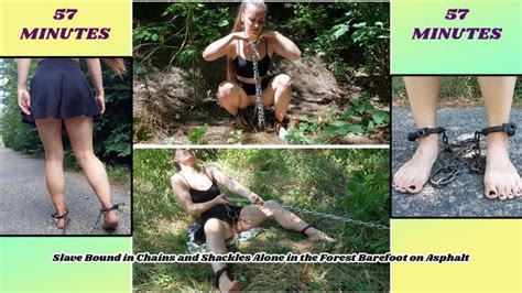 Slave Bound In Chains And Shackles Alone In The Forest Barefoot On