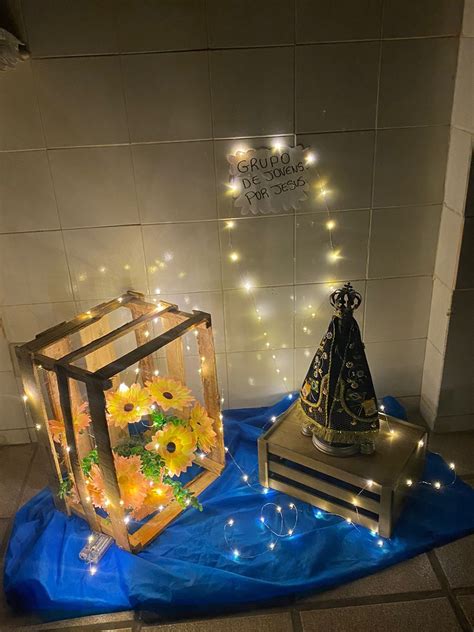 Two Small Wooden Boxes With Flowers In Them On A Blue Cloth Covered