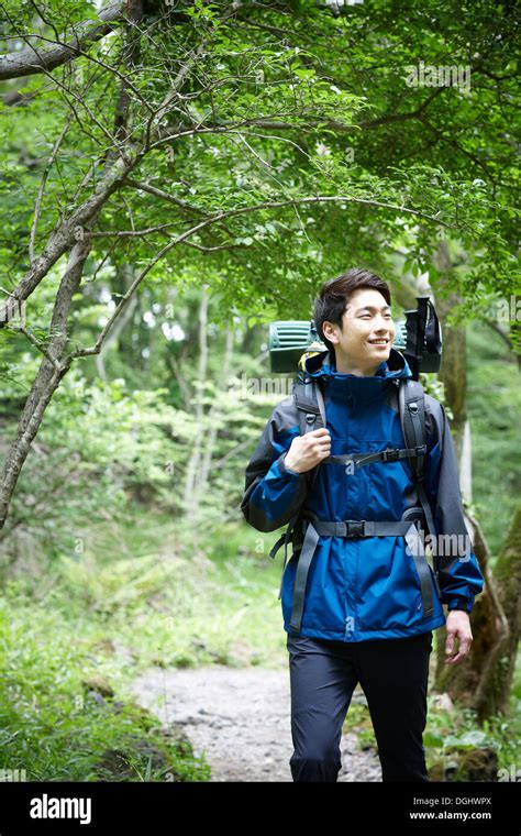 A Man Hiking In The Woods Stock Photo Alamy