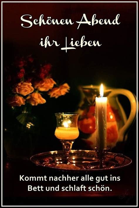 A Candle And Some Flowers On A Table