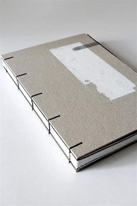 An Open Book Sitting On Top Of A White Table