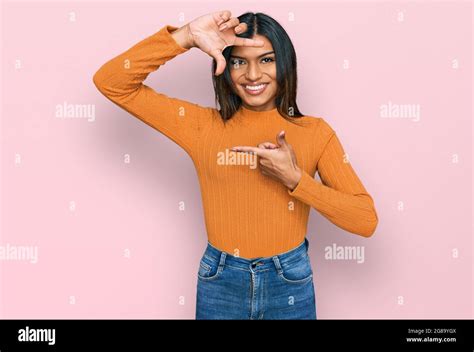 Young Latin Transsexual Transgender Woman Wearing Casual Clothes Smiling Making Frame With Hands