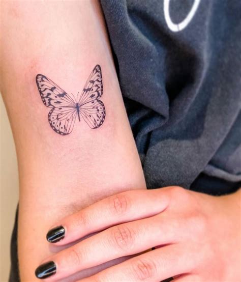 Fine Line Butterfly Tattoo On The Bicep