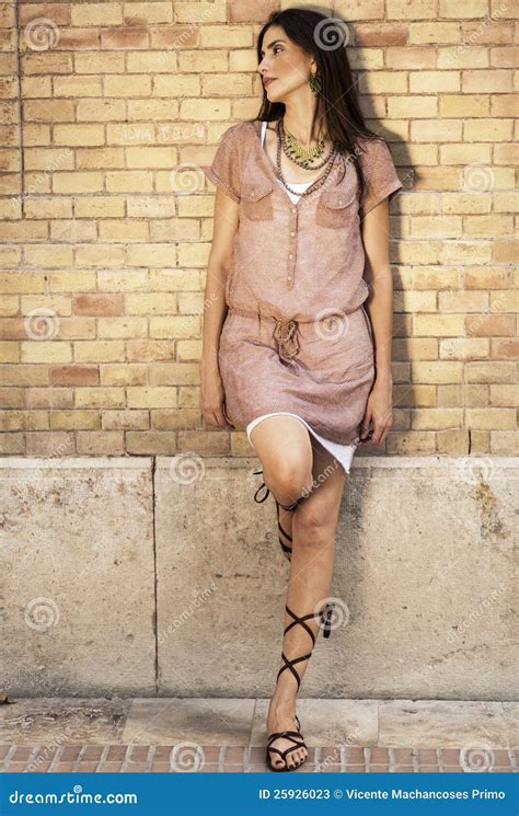Beatiful Woman Leaning Against A Brick Wall Stock Image Image Of
