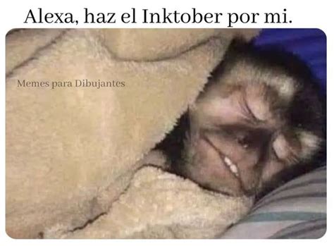 A Man Is Laying In Bed With His Head Under The Covers And Smiling At