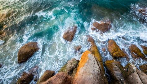 Aerial View Top Seashore Rocky Coast Waves Crashing On Rock Cliff