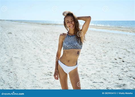 Gorgeous Woman With Perfect Slim Body In Stylish Swimwear Resting On