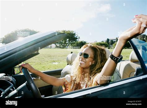 Mixed Race Woman Driving Convertible Stock Photo Alamy