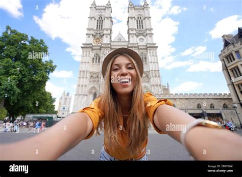 Young Traveler Girl Taking Selfie Photo In London With Westminster Abbey Gothic Church Young