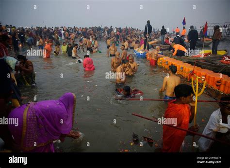 Hindu Devotees Take Holy Dips In The Confluence Of The Ganges And