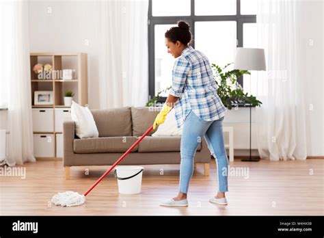 African Woman Or Housewife Cleaning Floor At Home Stock Photo Alamy
