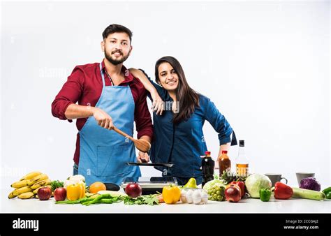 Indian Couple In Kitchen Young Beautiful Asian Wife Enjoying Cooking With Husband With Lots Of
